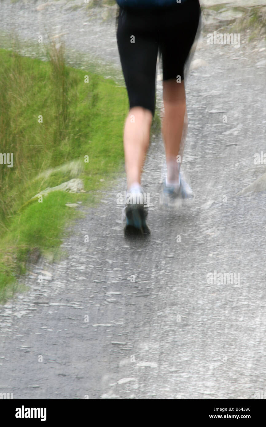 one fast woman runner on mountain country path Stock Photo - Alamy
