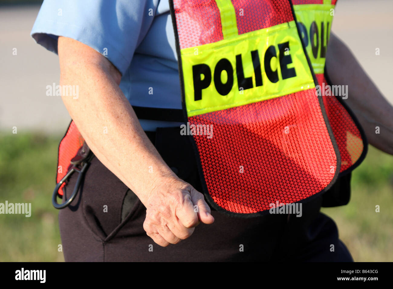 A female police officer running Stock Photo - Alamy