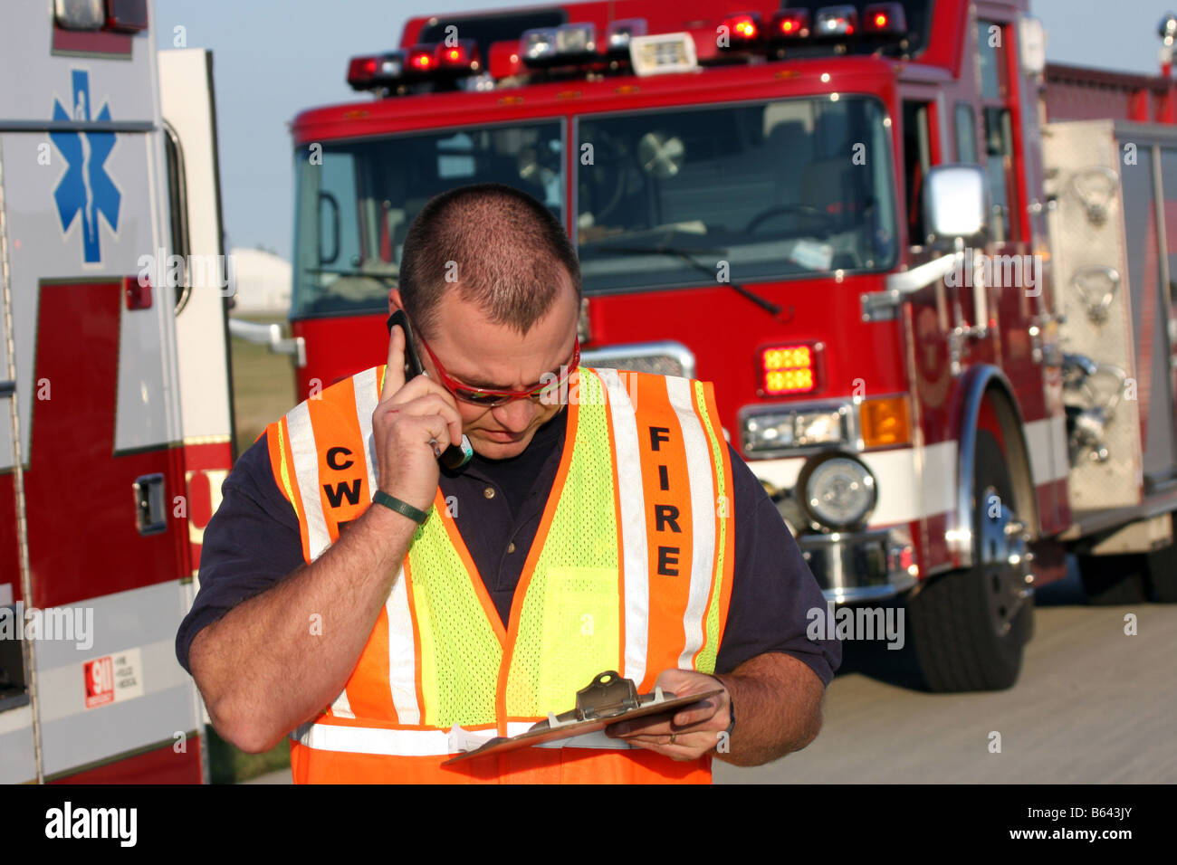A paramedic on a cell phone Stock Photo - Alamy