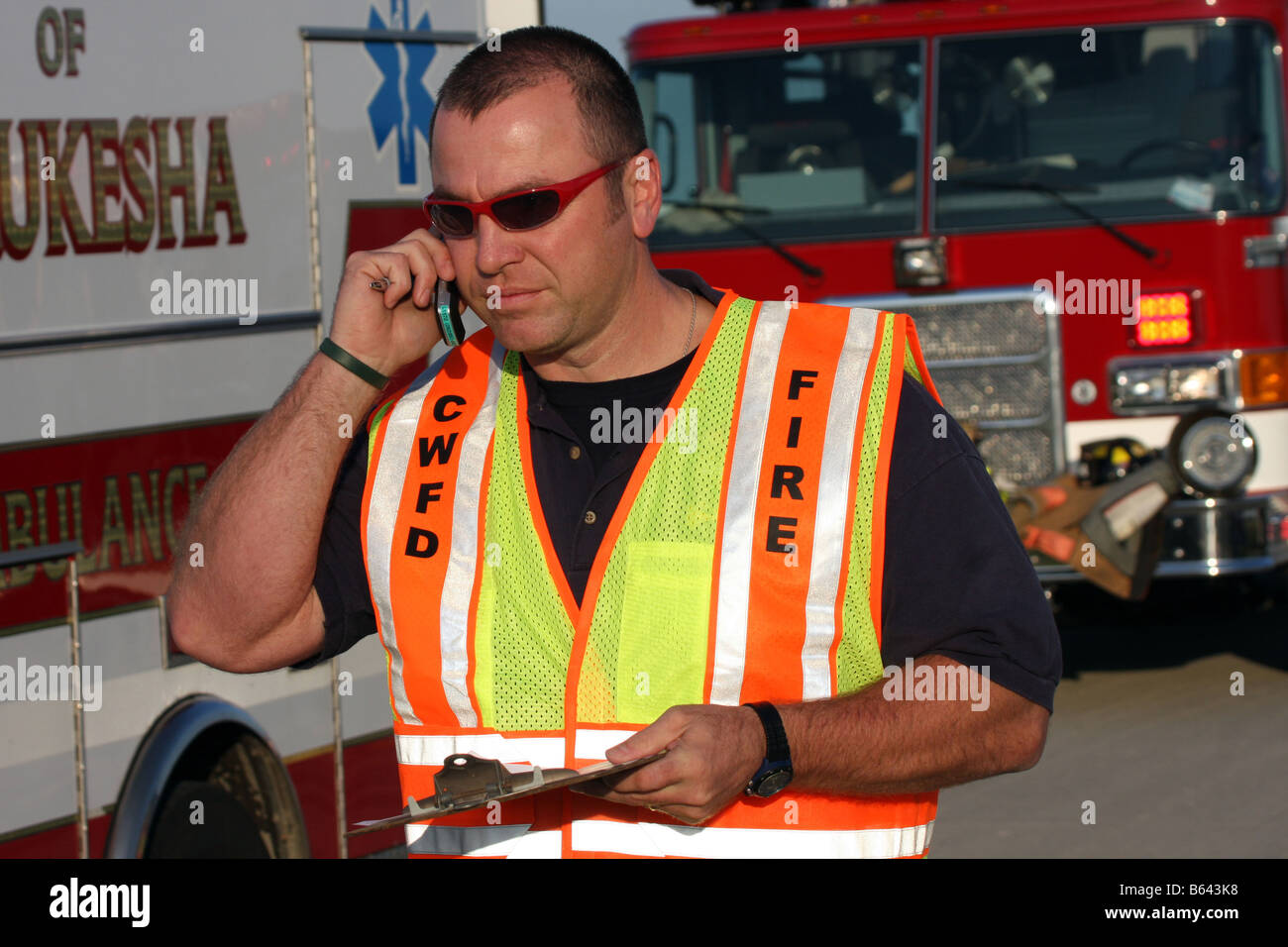 A paramedic on a cell phone Stock Photo - Alamy