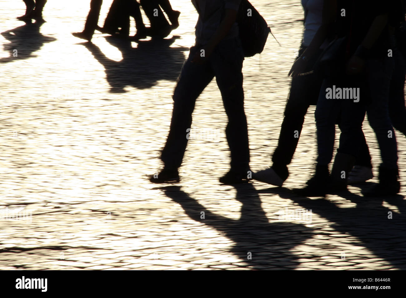 shadow people fast speed feet legs walking in sun in street in town ...