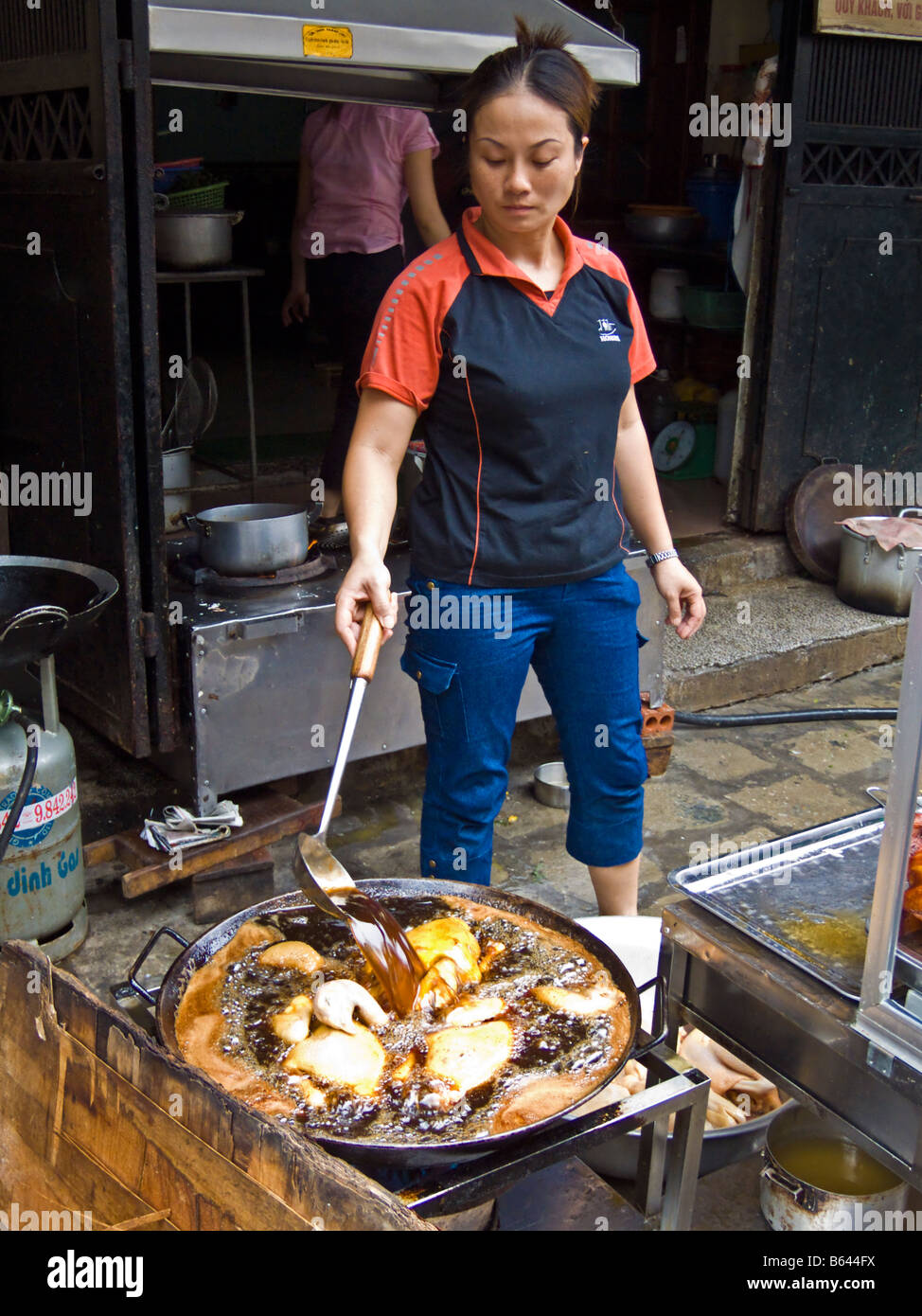 Woman cooking duck on the street Hanoi Vietnam JPH0147 Stock Photo - Alamy