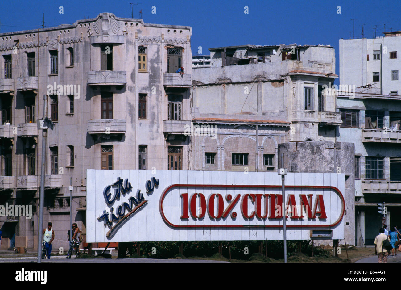 Street scene with sign reading 'This Land is 100 Cuba', Havana, Cuba ...
