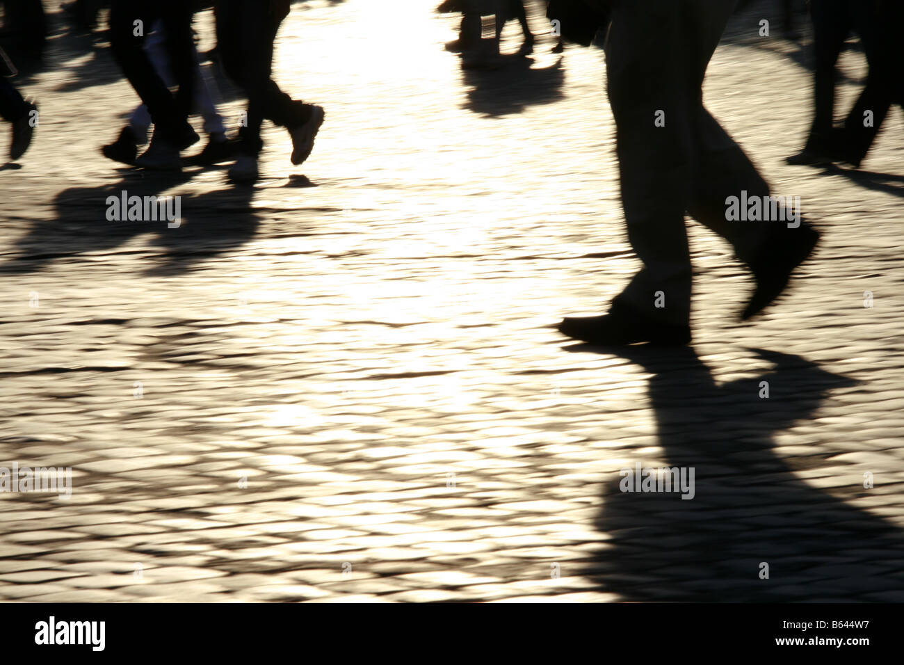 shadow person fast speed feet legs walking in street in town Stock ...