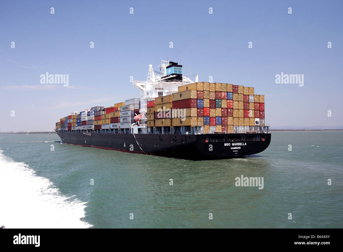 REAR VIEW OF CONTAINER SHIP HEADING UP THE BRISBANE RIVER QUEENSLAND ...