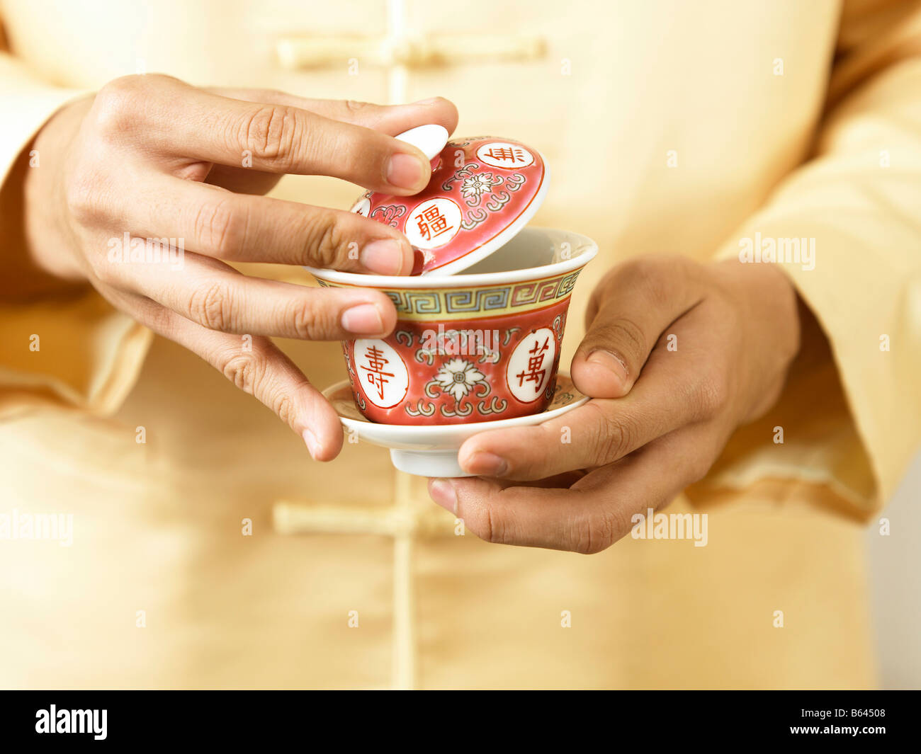 close up on hands with chinese tea cup Stock Photo - Alamy