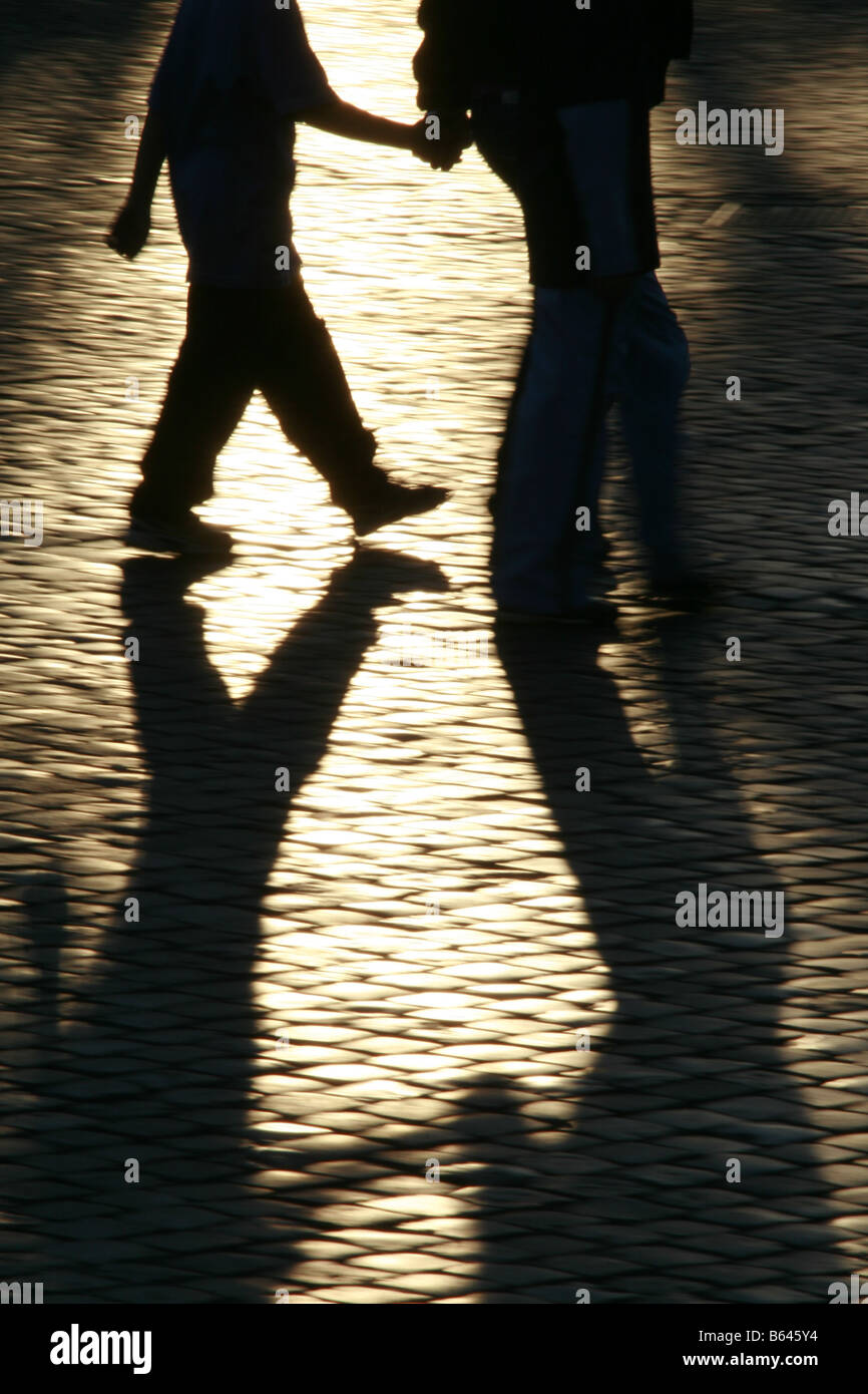 shadow people fast speed feet legs walking in street in town Stock ...