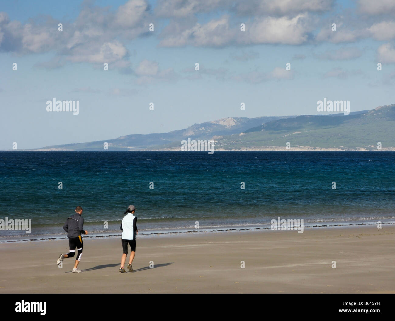 Footing woman on beach hi-res stock photography and images - Alamy