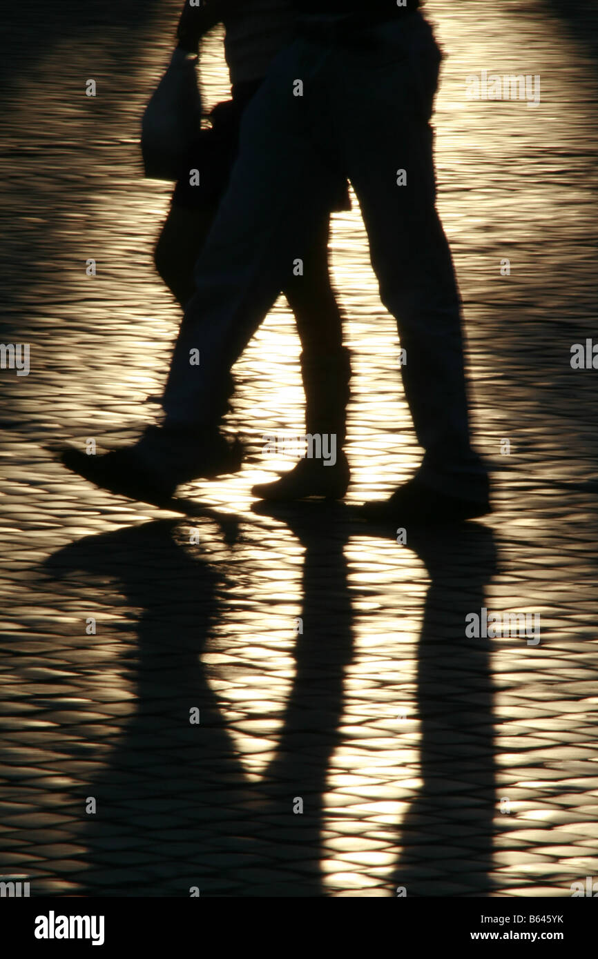 shadow people fast speed feet legs walking in street in town Stock ...