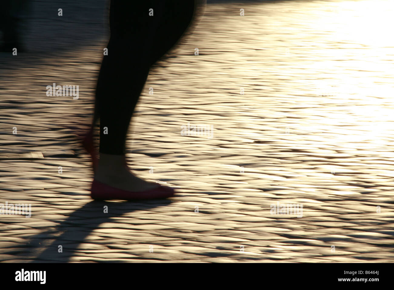shadow person fast speed feet legs walking in street in town Stock ...