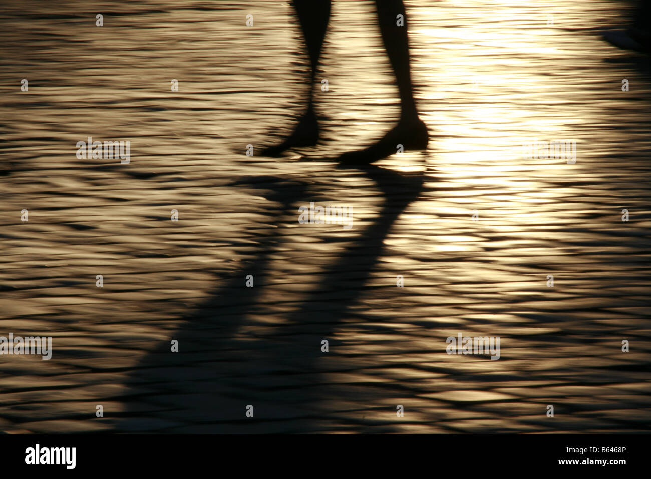 shadow person fast speed feet legs walking in street in town Stock ...