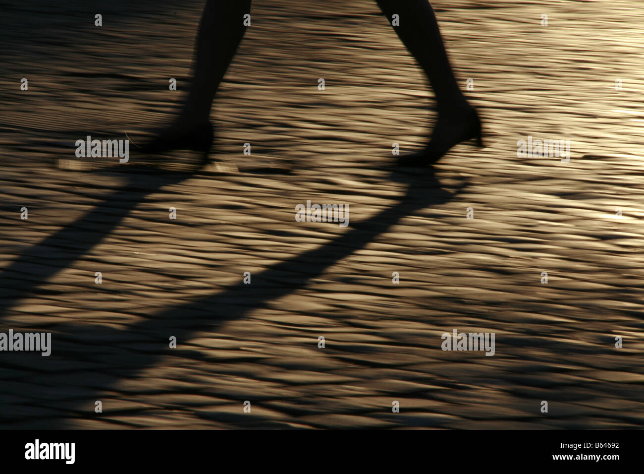 shadow person fast speed feet legs walking in street in town Stock ...