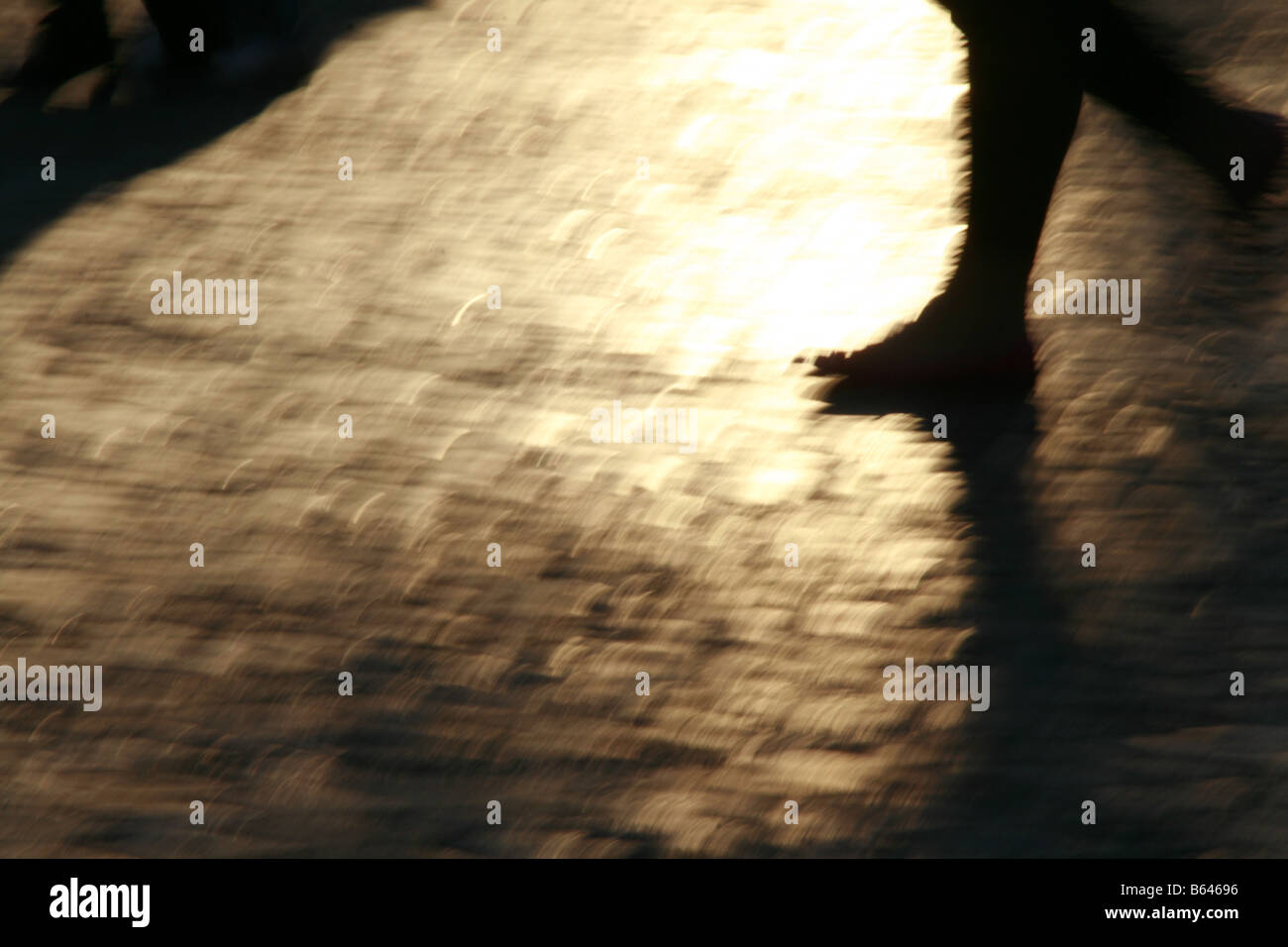 shadow person fast speed feet legs walking in street in town Stock ...
