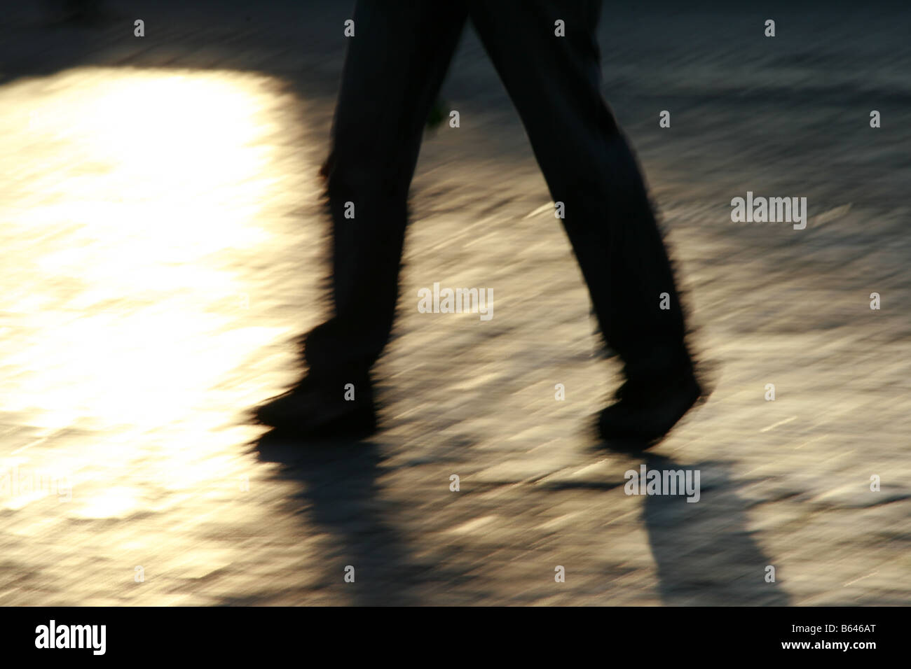 shadow person fast speed feet legs walking in street in town Stock ...