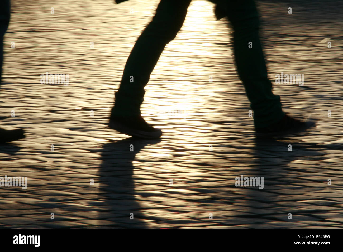 shadow person fast speed feet legs walking in street in town Stock ...