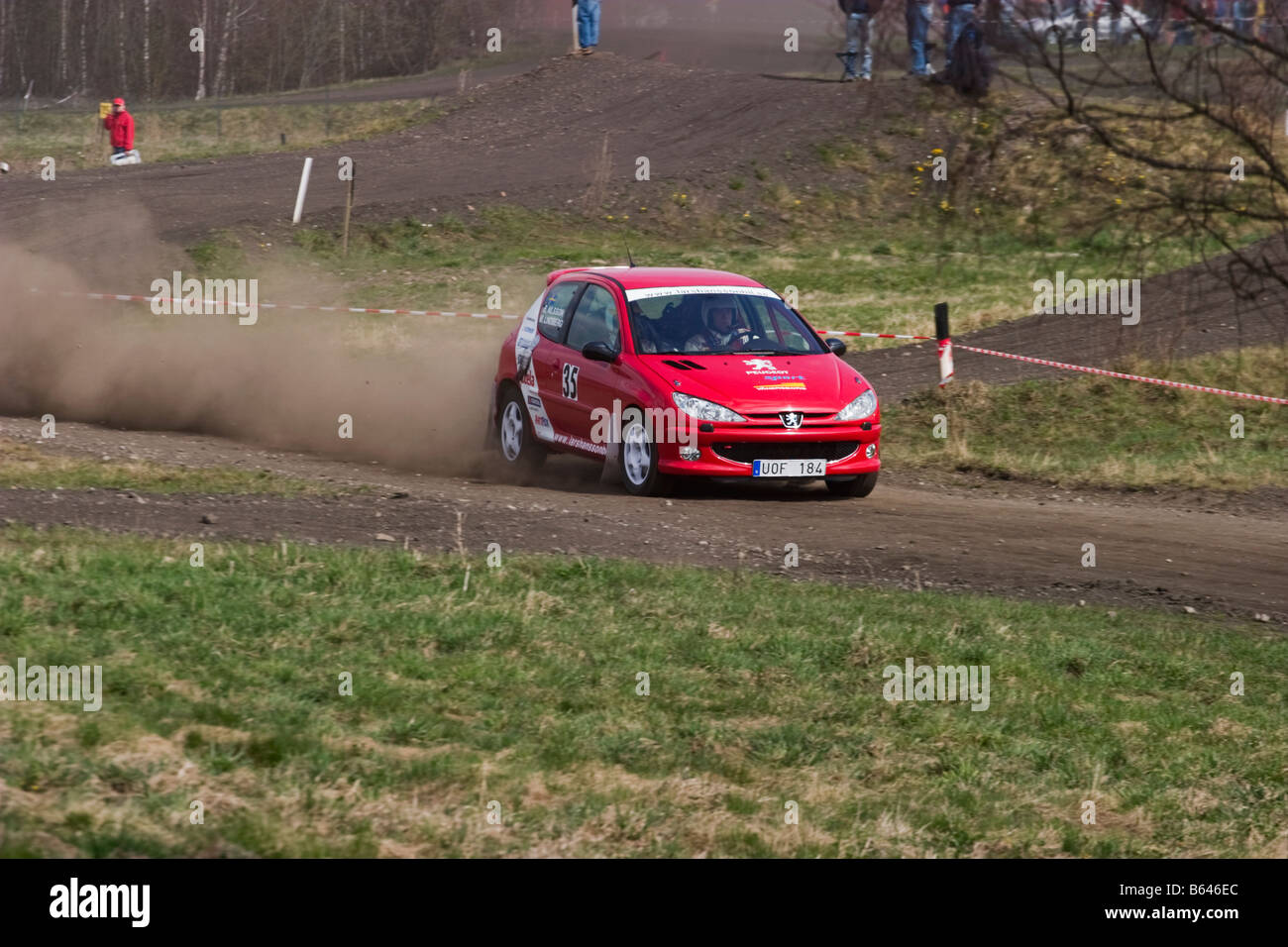 Red Peugeot rally car in a race Stock Photo - Alamy