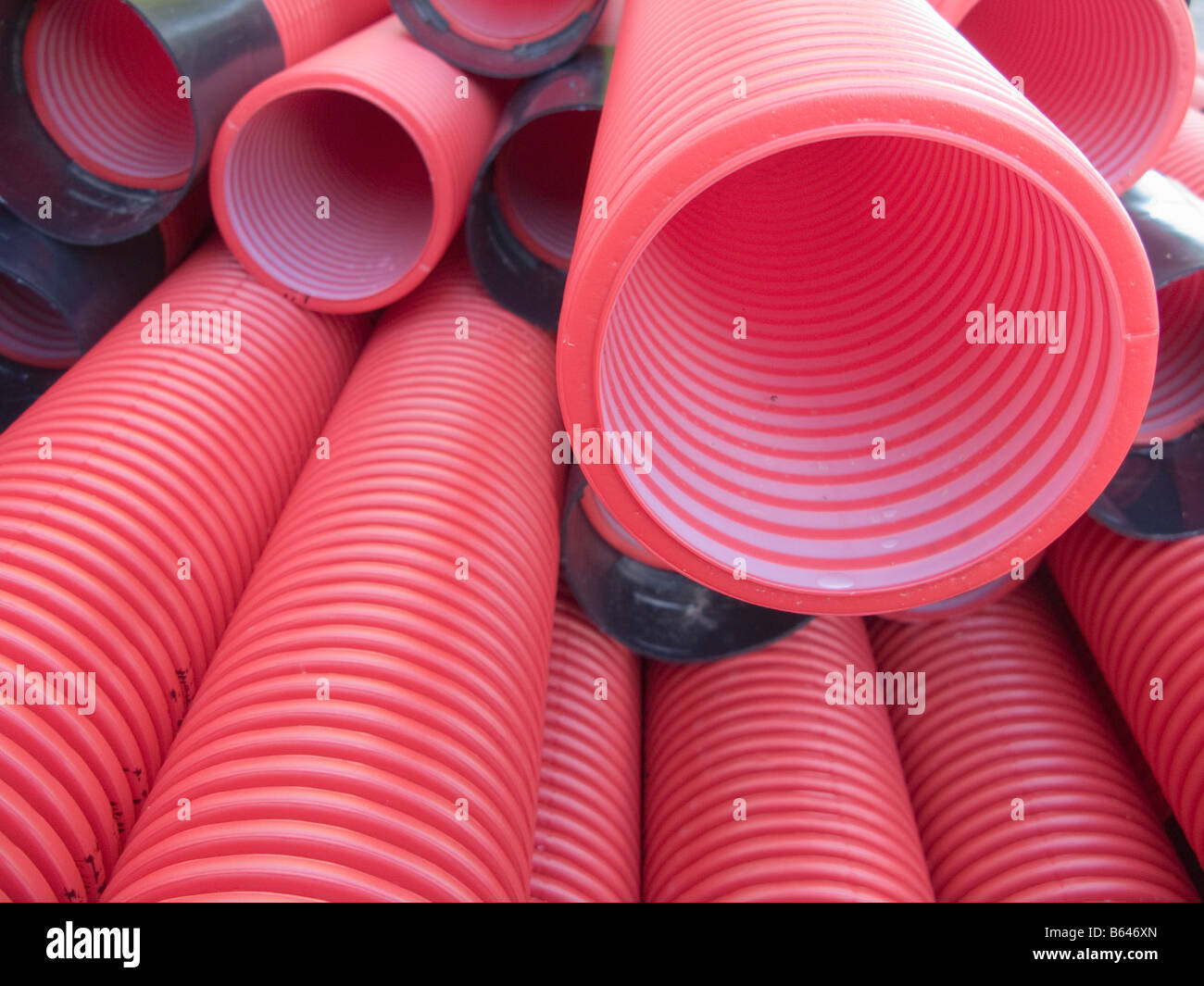 Red electrical tubes Stock Photo - Alamy