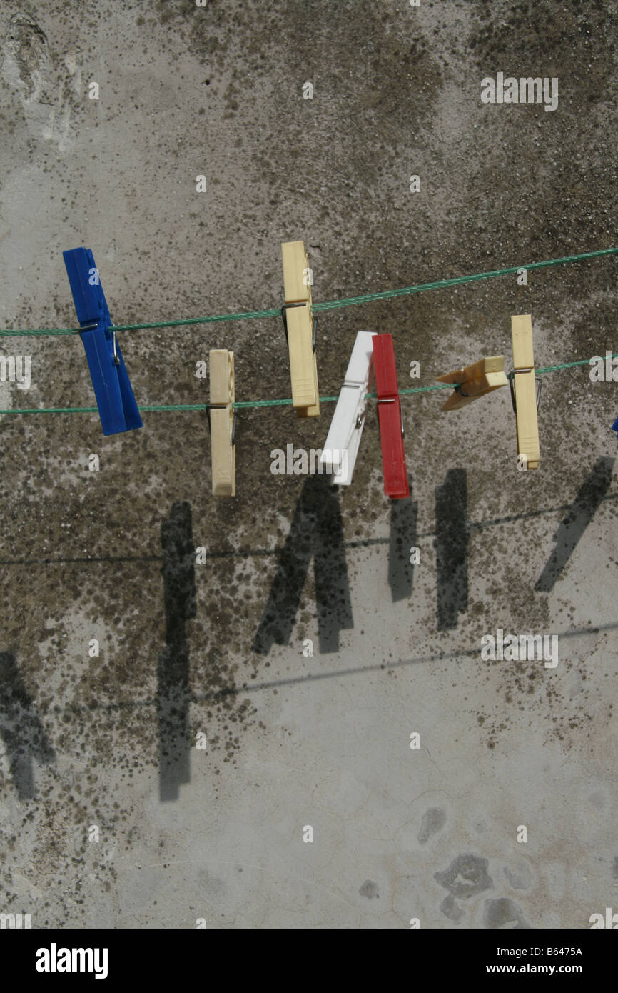 clothes pegs shadow and washing line outdoors Stock Photo - Alamy
