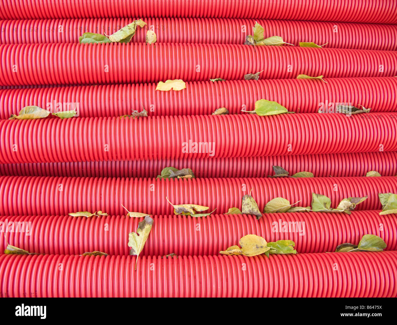 Red electrical tubes Stock Photo - Alamy