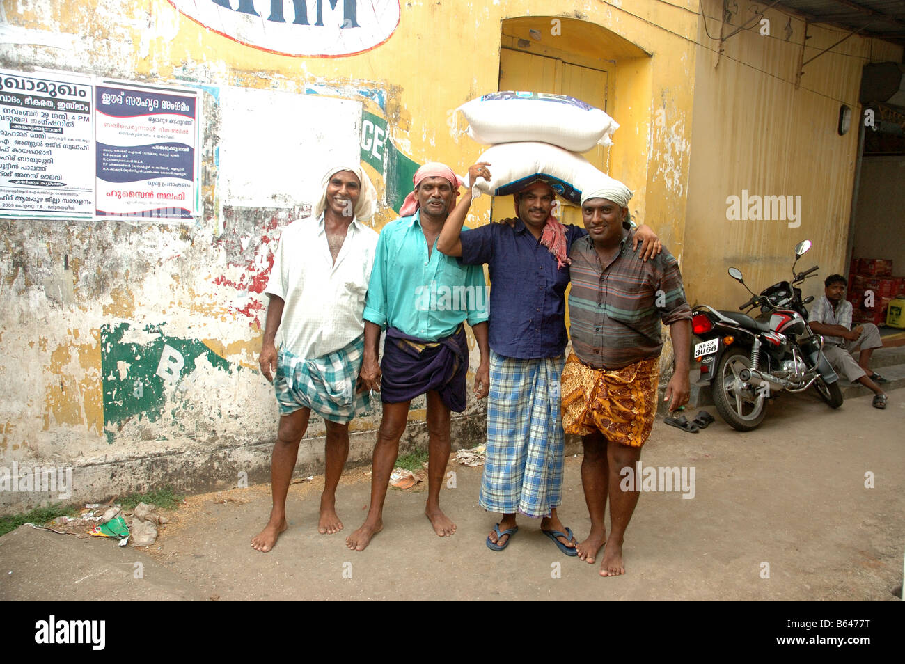 Four Indian men posing in the street og Cochin Stock Photo - Alamy