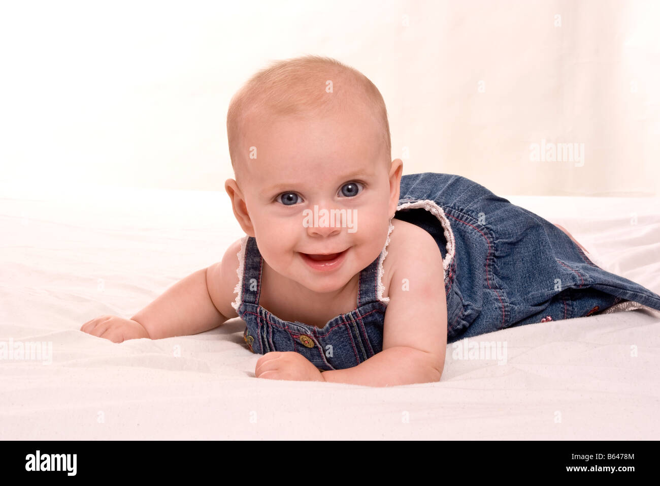 Baby girl crawling Stock Photo - Alamy