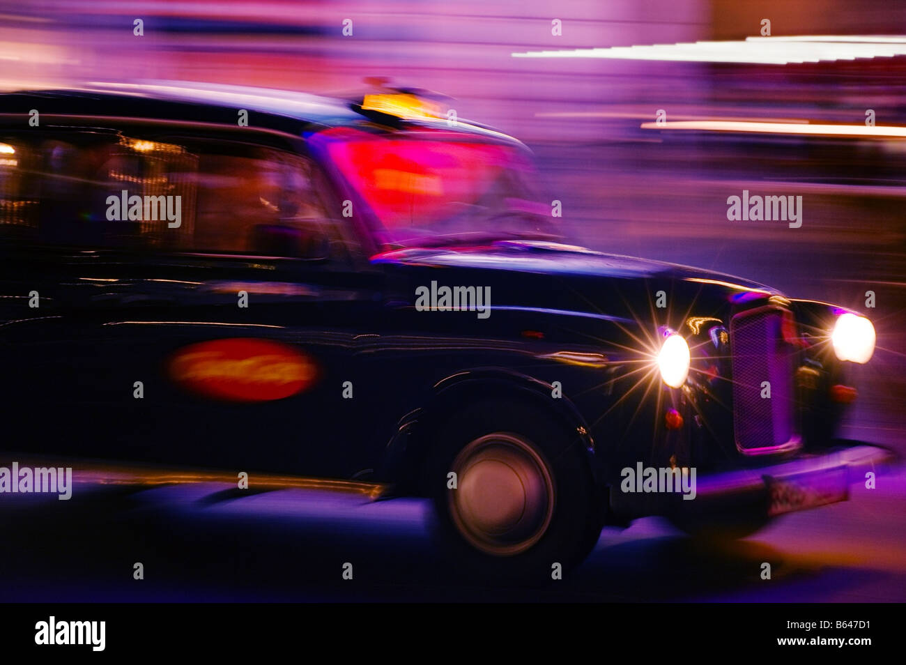 London taxi at night with motion blur Stock Photo - Alamy