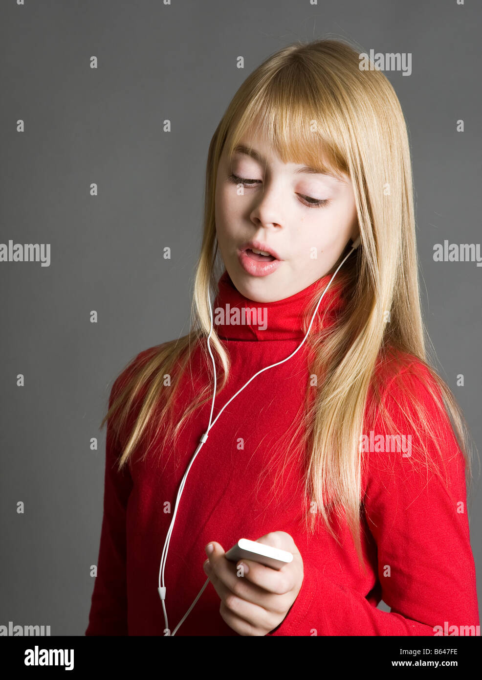 Child listening to music Stock Photo - Alamy