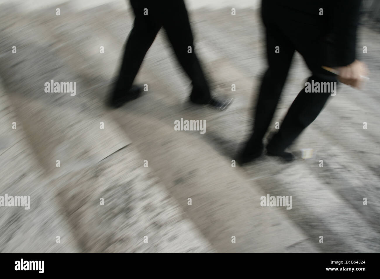 two people walking down steps in city Stock Photo - Alamy
