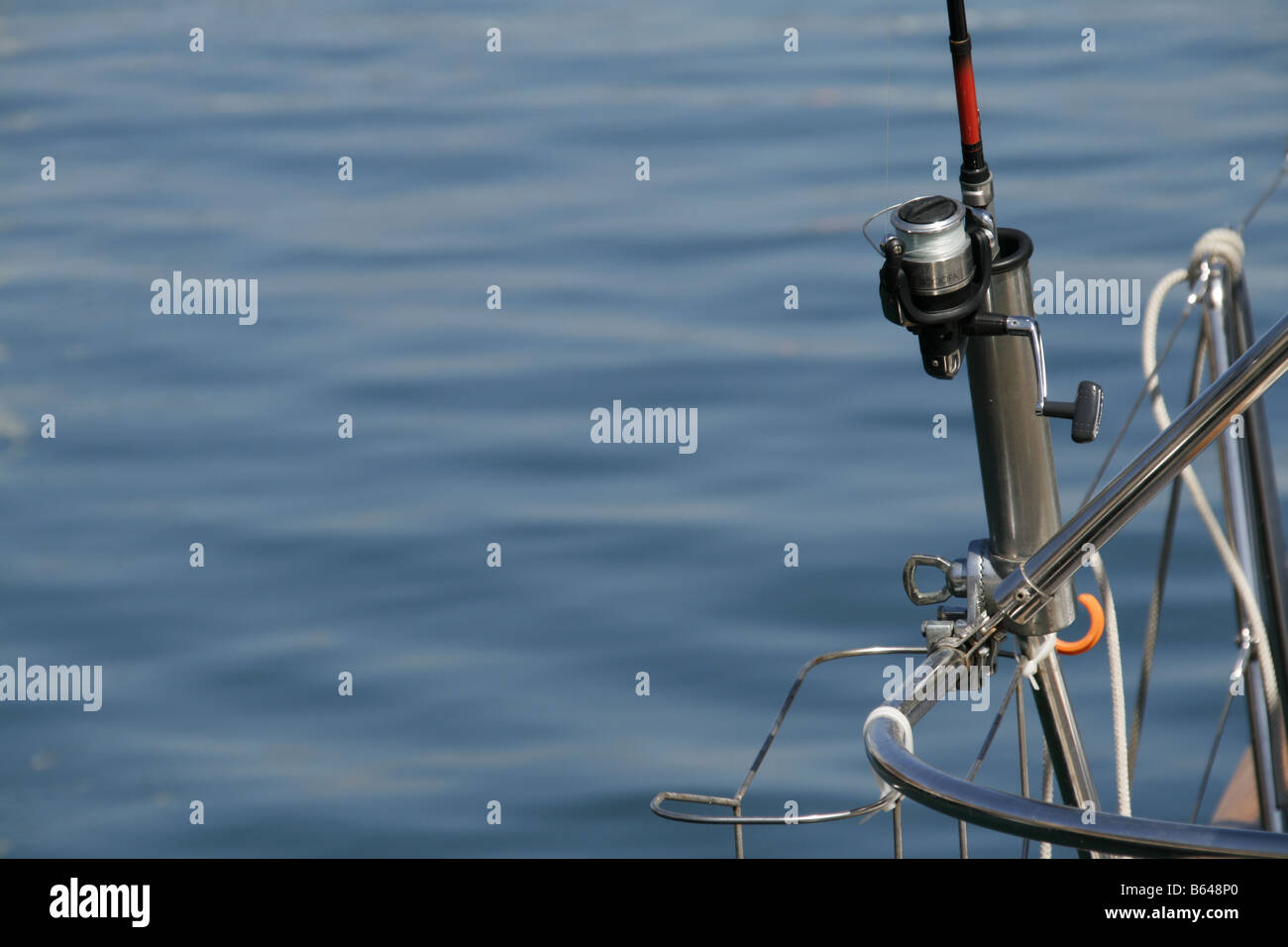 one fishing rod on boat trip and sea Stock Photo - Alamy