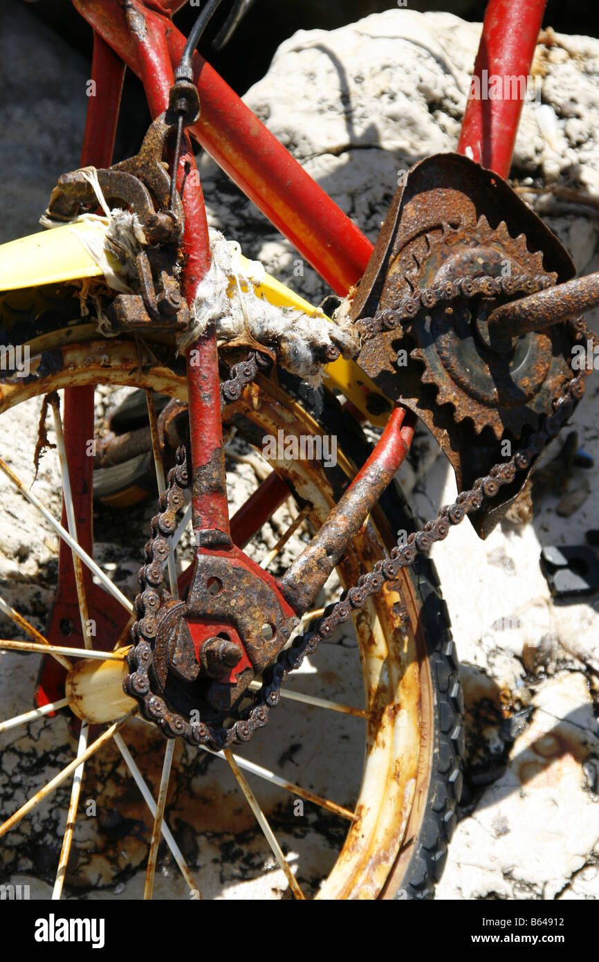 one damaged red bike frame chain outdoors in sun Stock Photo - Alamy