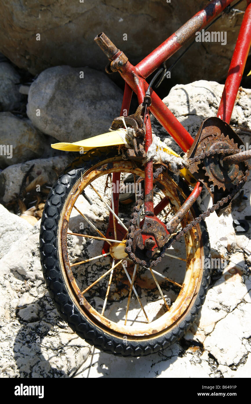 one damaged red bike frame chain outdoors in sun Stock Photo - Alamy