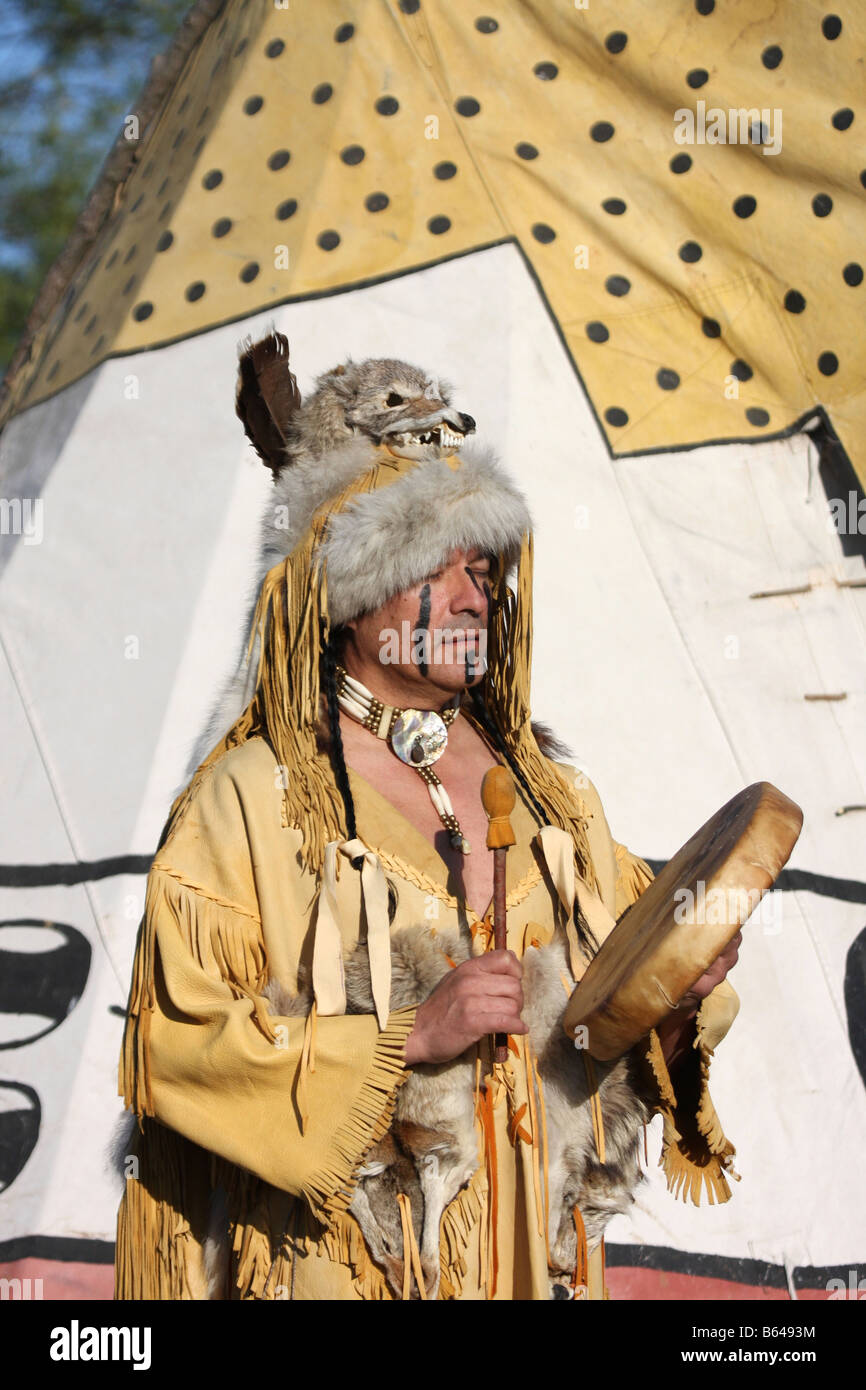Apache Native American Indian drumming with a drum Stock Photo - Alamy