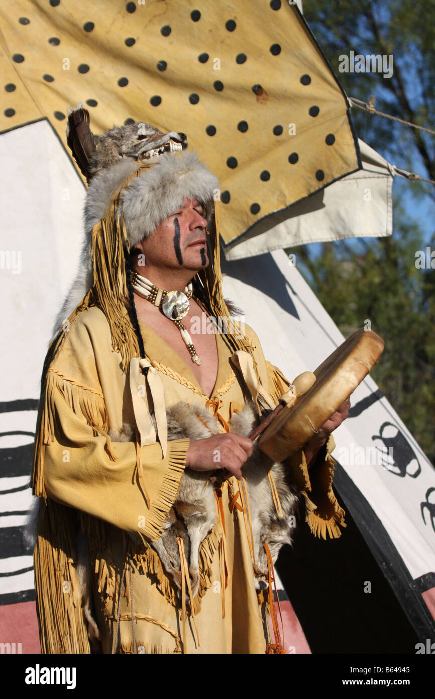 Apache Native American Indian beating his drum singing Stock Photo - Alamy
