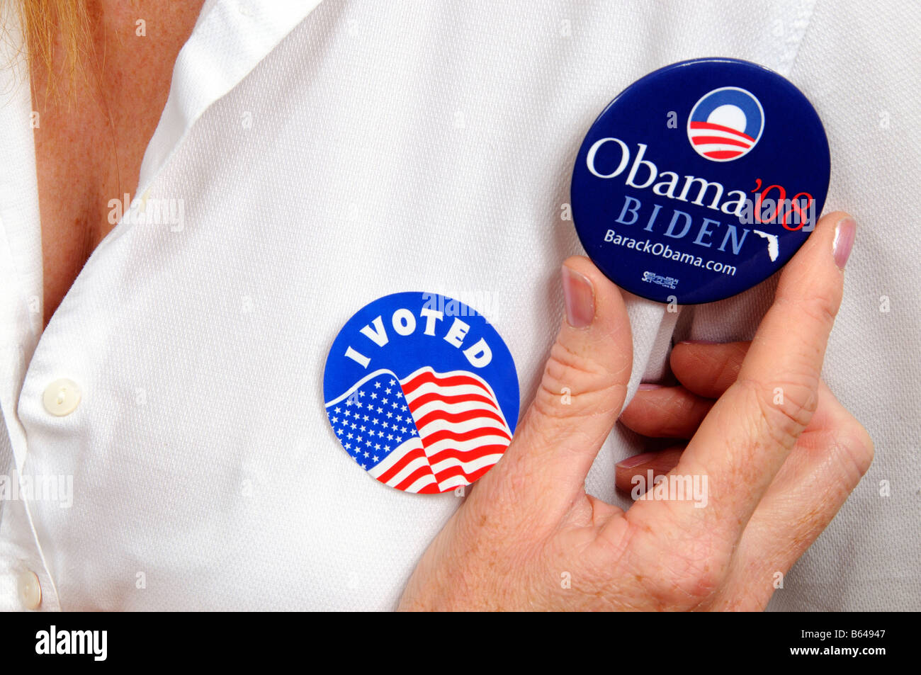 Woman wearing I voted sticker and Barack Obama election badge Stock ...