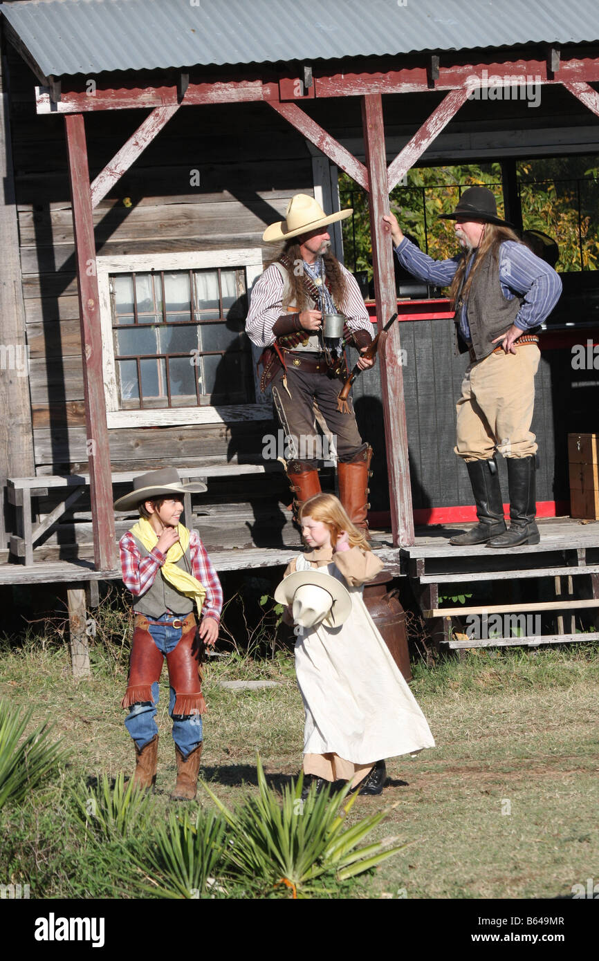 Towns people adults and children in an old western town Stock Photo - Alamy