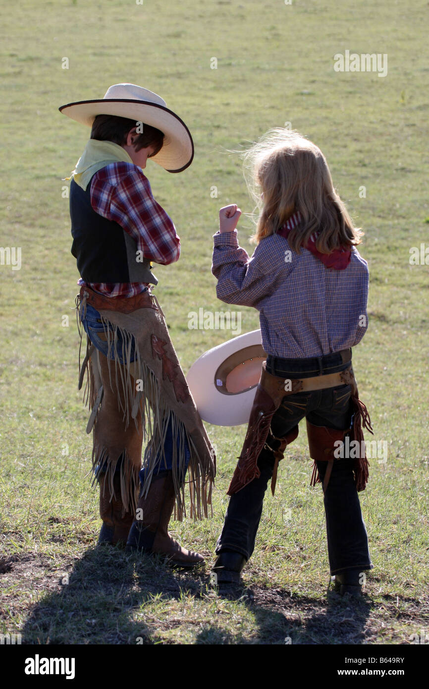 A young cowboy and cowgirl having a disagreement or fight Stock Photo ...