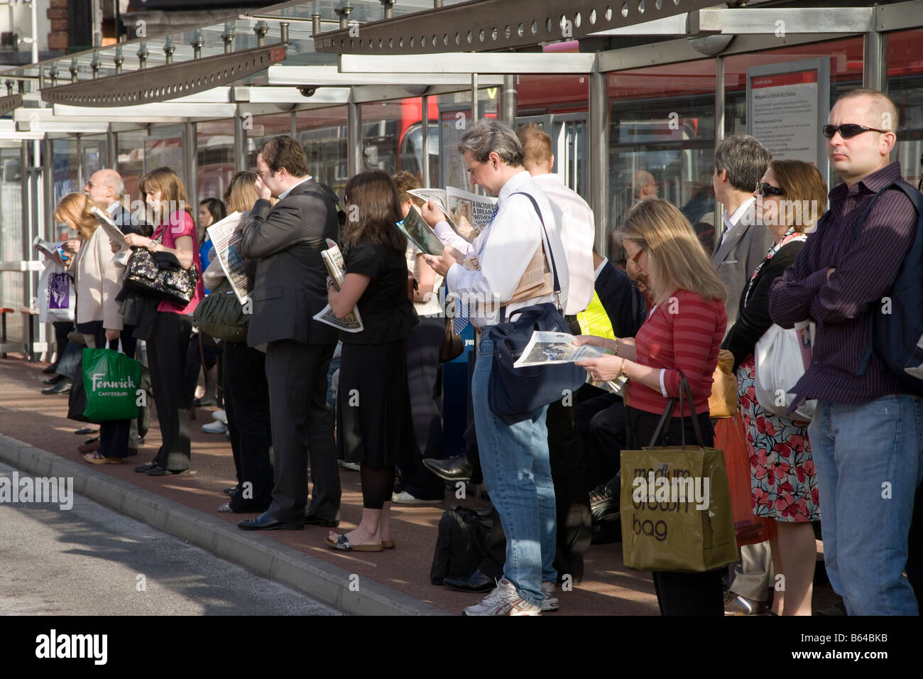 Passengers waiting for bus at Victoria bus station London Stock Photo ...