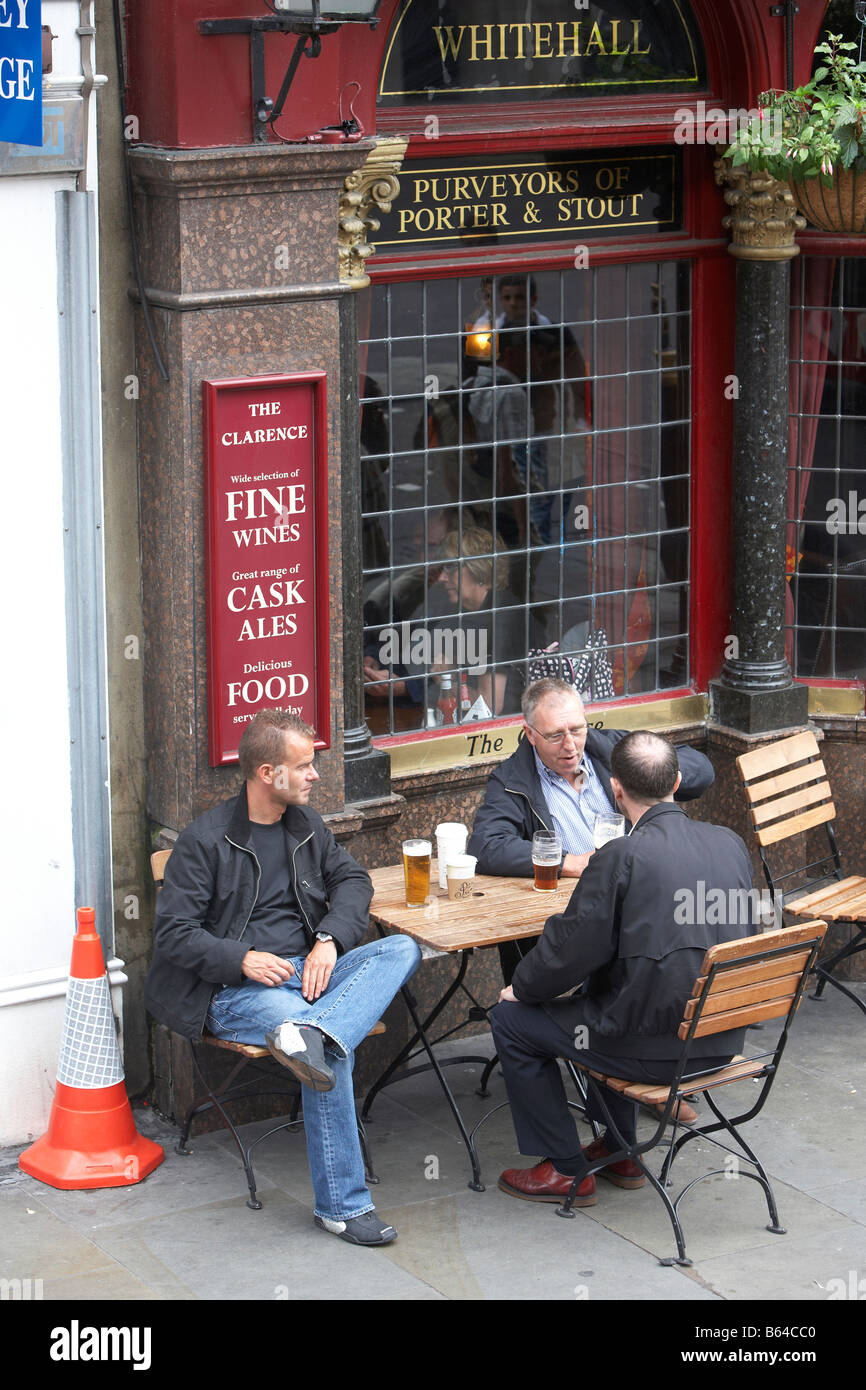 3 Men having a pint of beer outside of London pub Stock Photo - Alamy