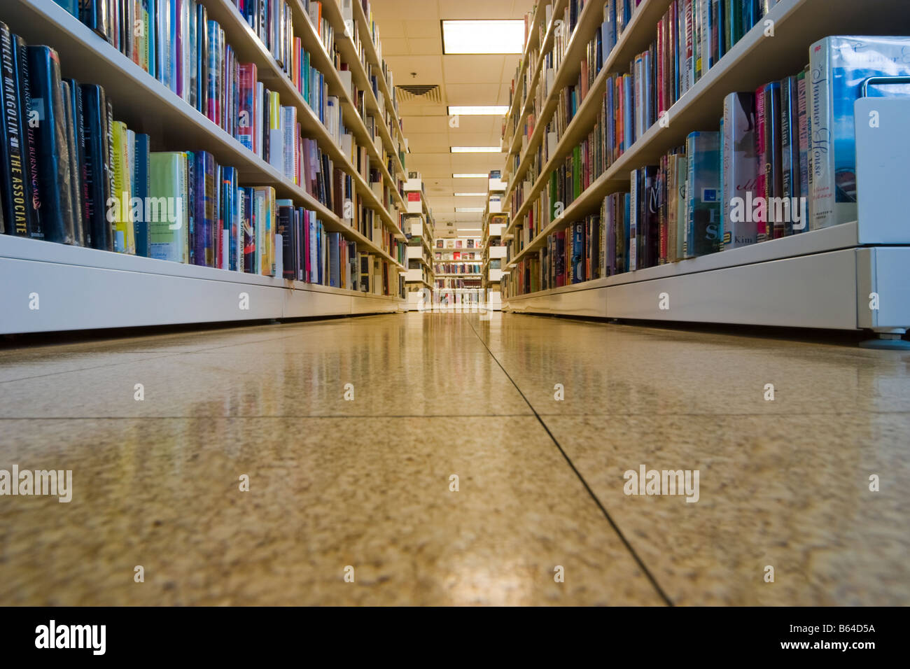 Bookshelves in a library filled with books Stock Photo - Alamy