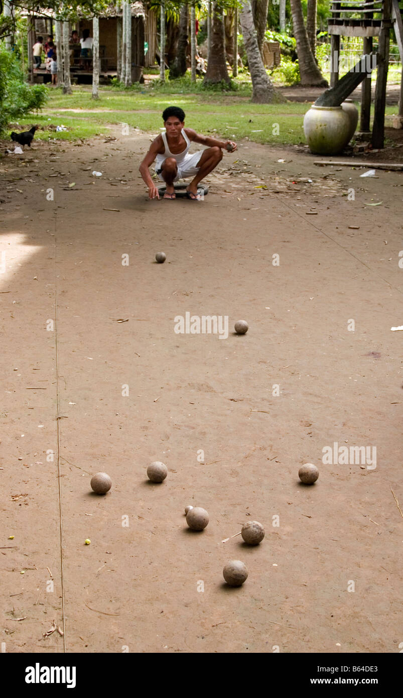 petanque player surveys the pitch in rural Laos Stock Photo - Alamy