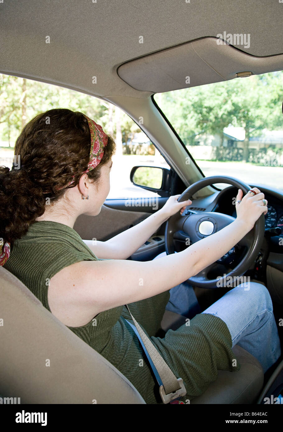 Vertical view of a teen driver from inside the car Stock Photo - Alamy