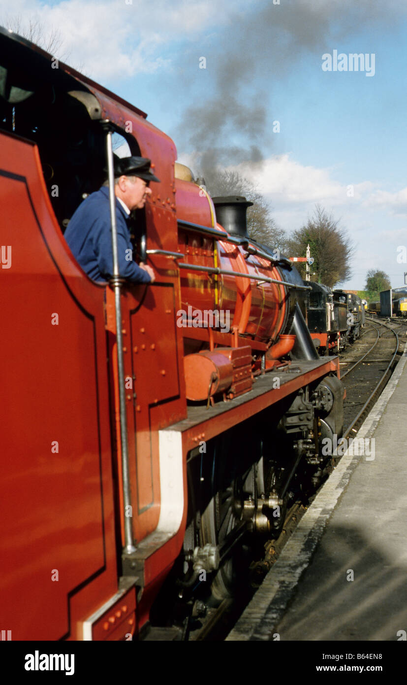 Temporarily red-painted locomotive of the Watercress line, Hampshire ...