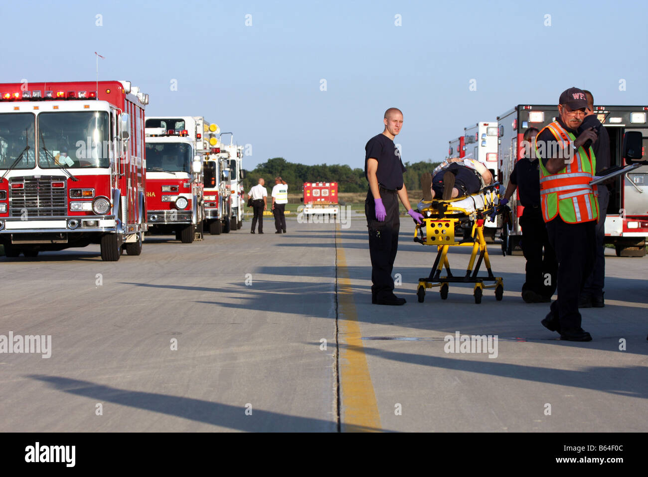 Fire trucks firefighters Ambulances patients and paramedics at the ...