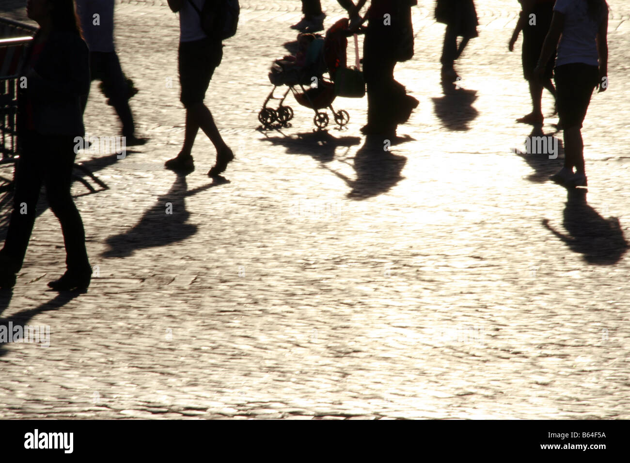 shadow people fast speed feet legs walking in sun in street in town ...