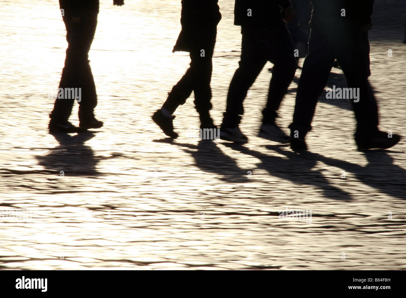 shadow people fast speed feet legs walking in sun in street in town ...