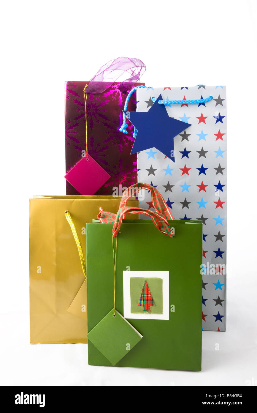 Four colourful gift bags isolated against white background Stock Photo ...