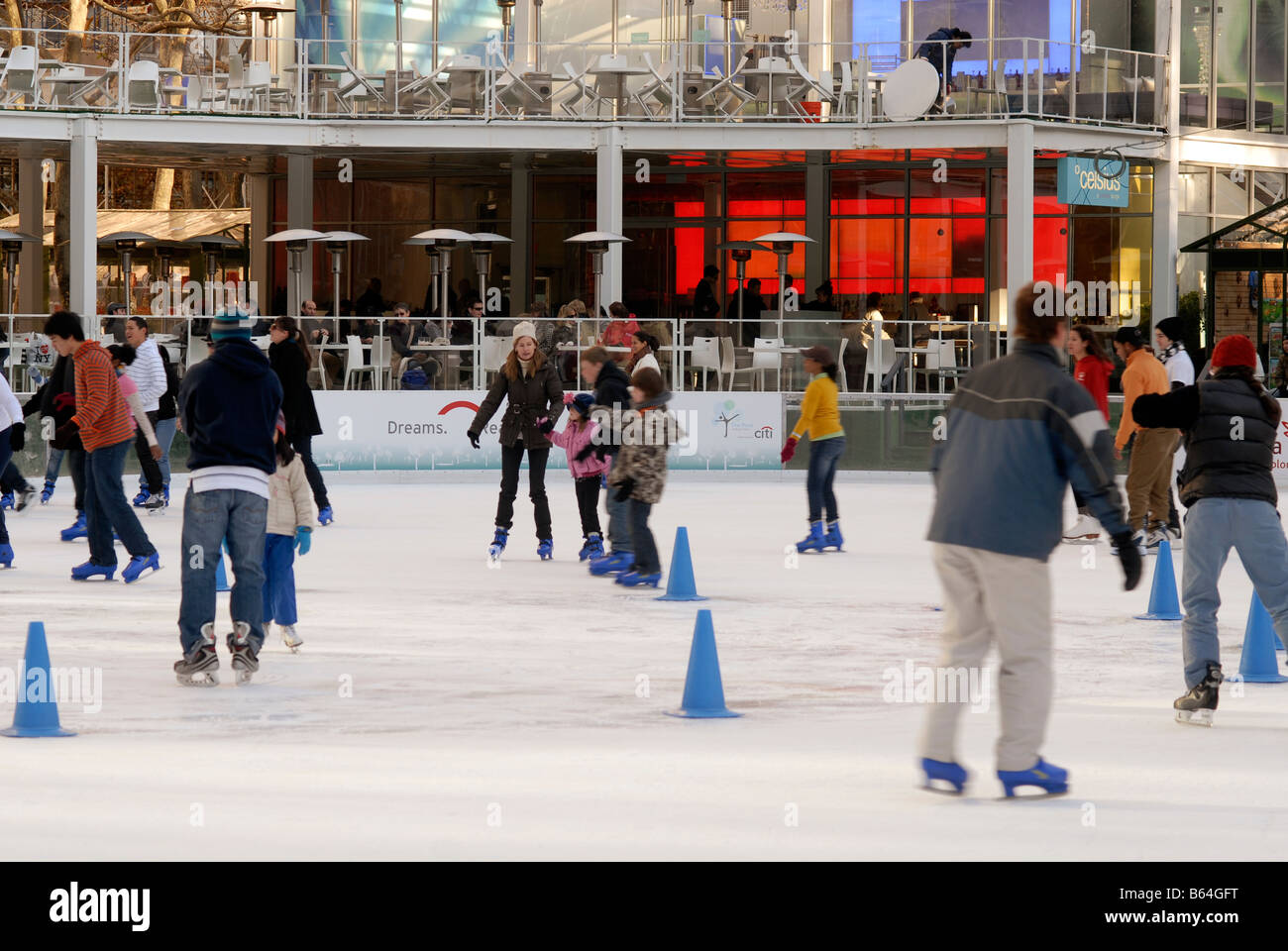 Skaters maneuver the packed Pond at Bryant Park ice skating rink in New ...