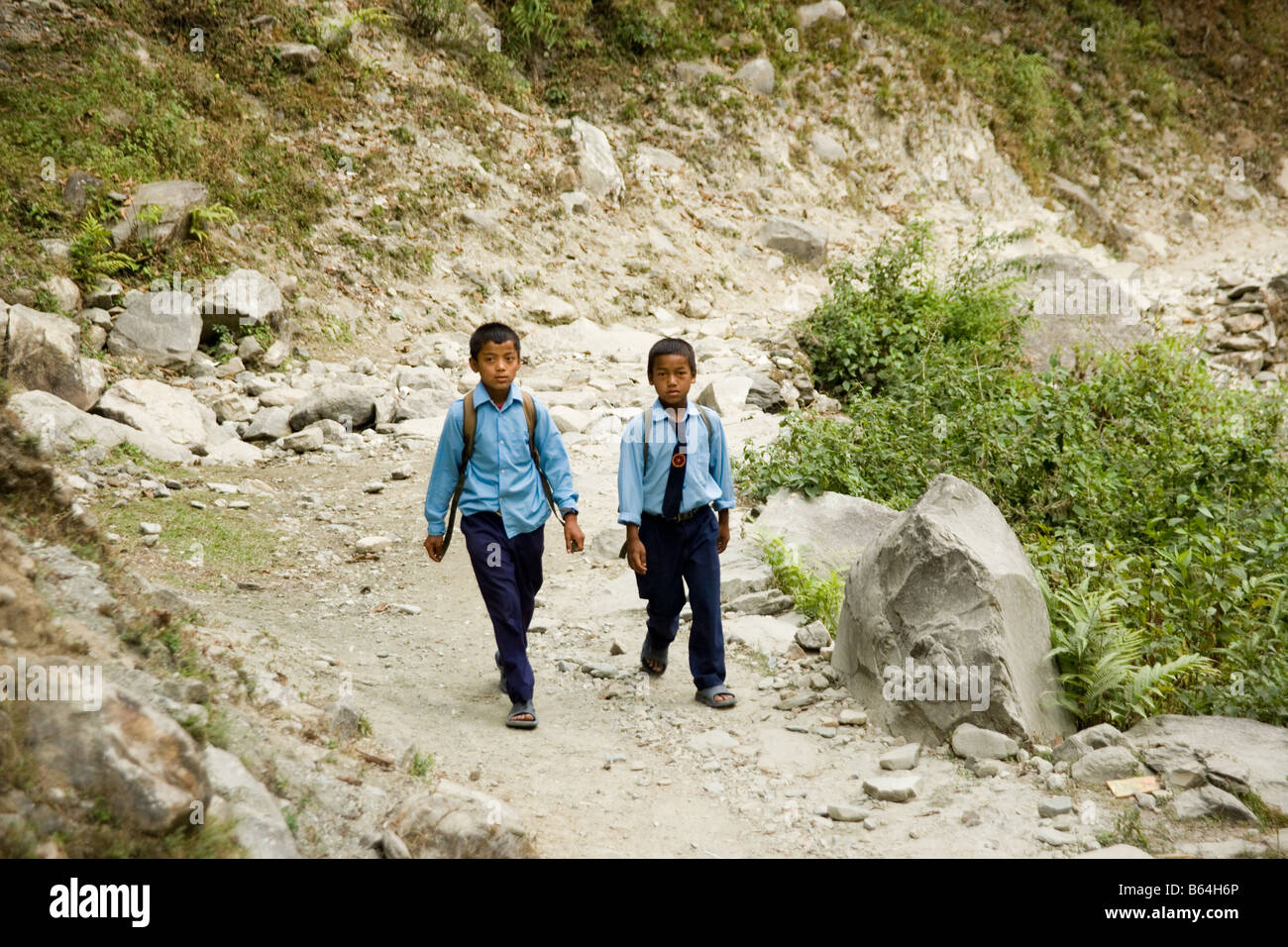 Two Nepalese schoolboys going home in the Modi River valley in the ...
