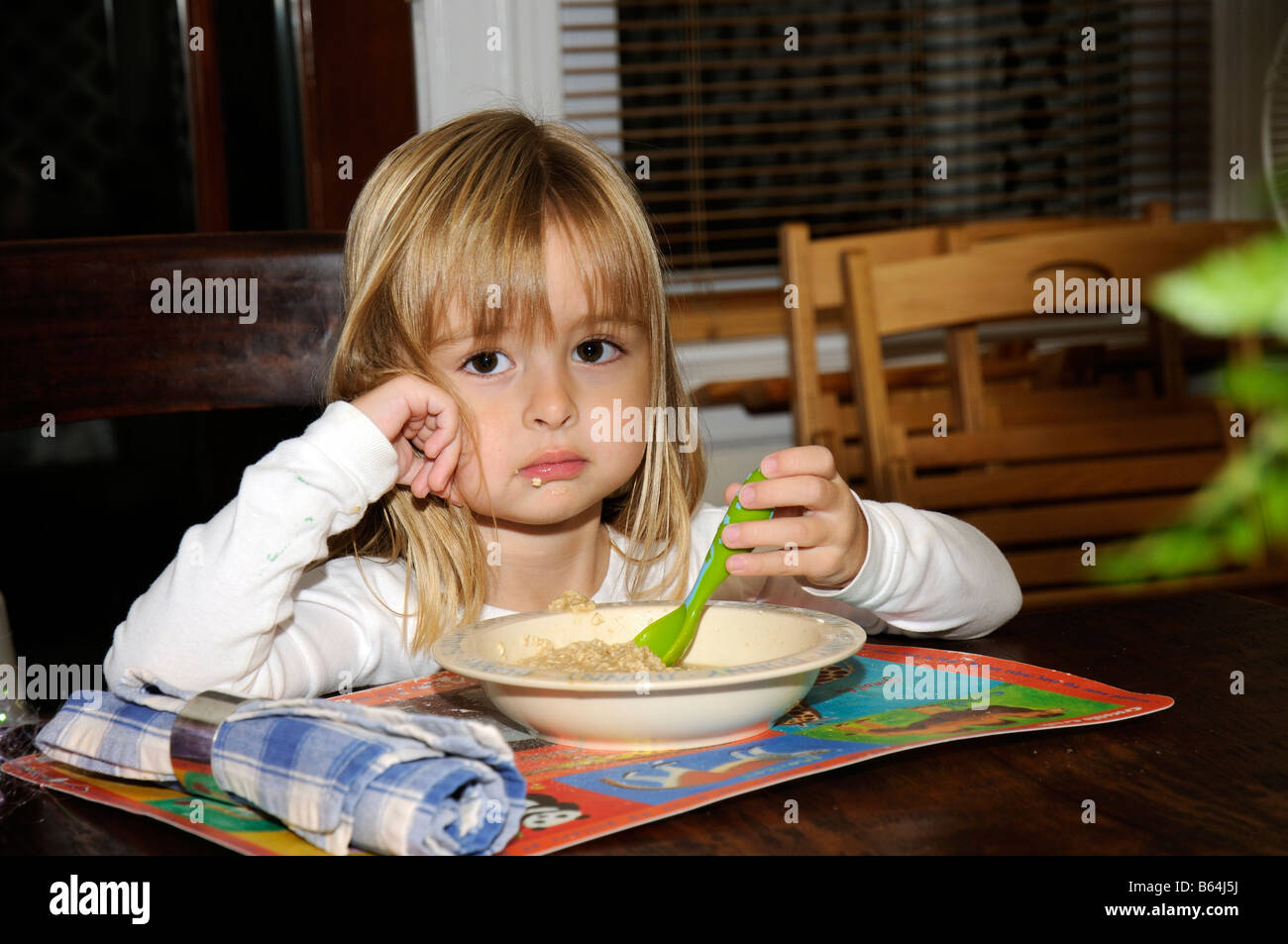 Little girl eating healthy food Stock Photo - Alamy