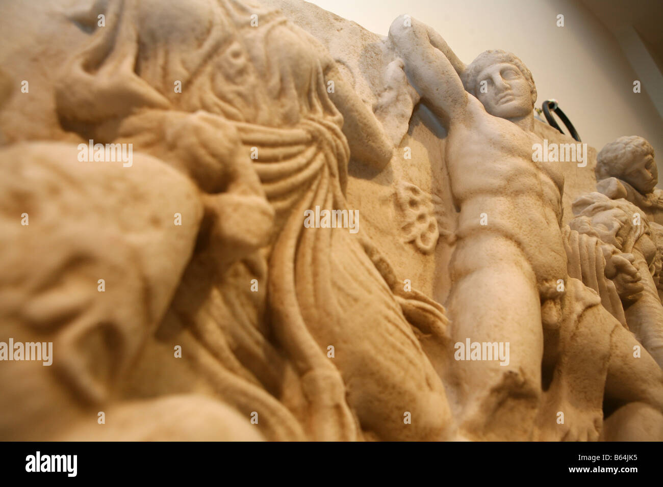 a traditional greek statue taken dramatically on a wall in a house ...